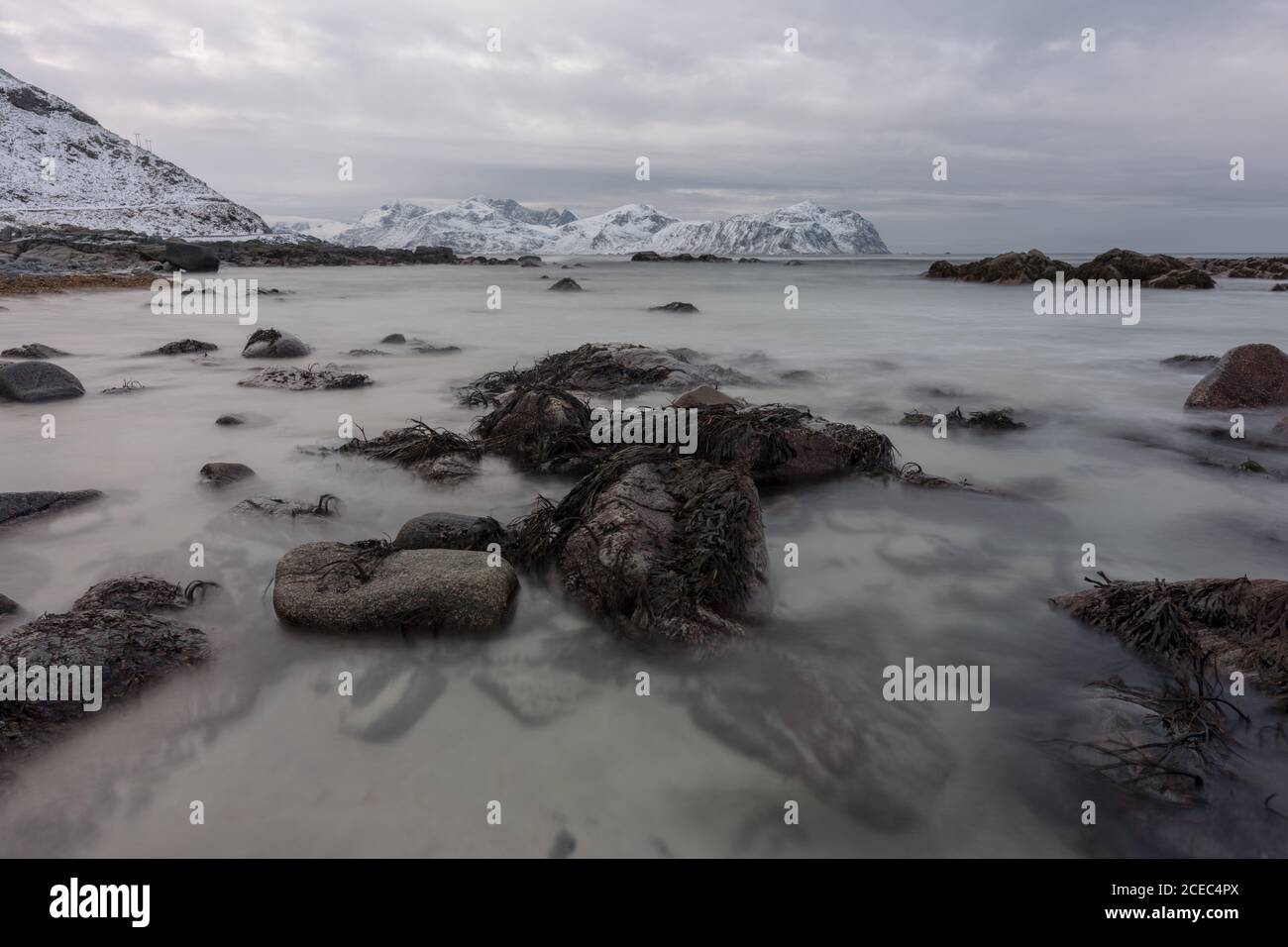 Smooth rocks in flow of water Stock Photo - Alamy