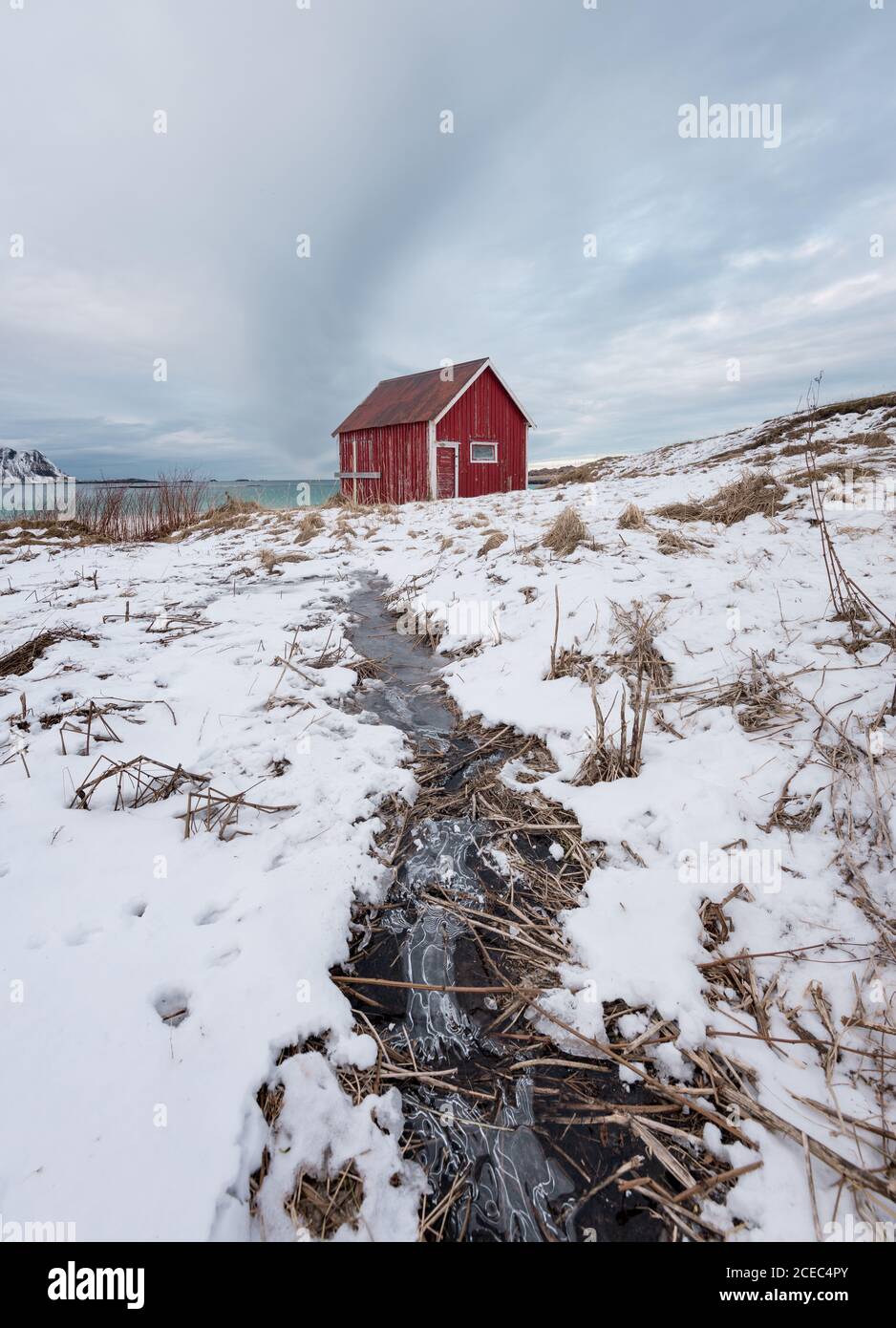 Red cabin on snowy shore Stock Photo - Alamy