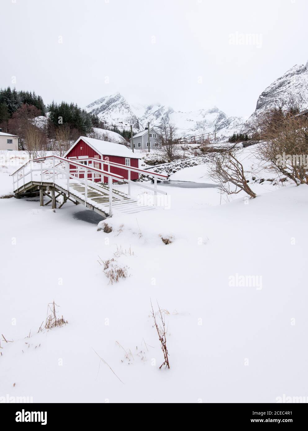 Red cabin on snowy valley Stock Photo - Alamy