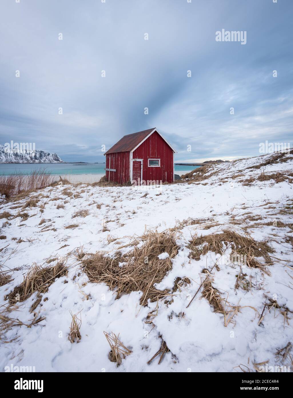 Red cabin on snowy shore Stock Photo - Alamy
