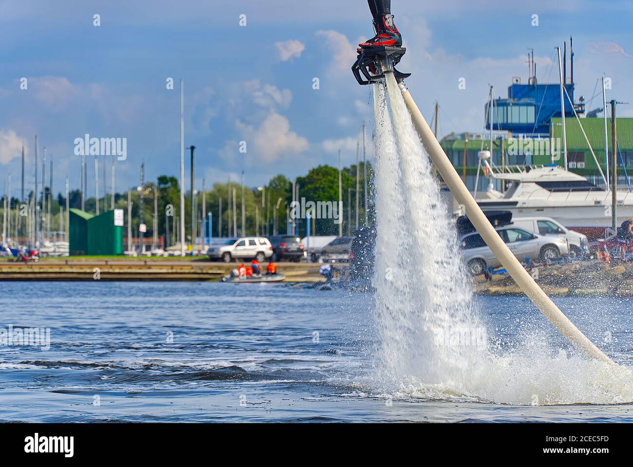 man having fun on Flyboard. Flyboarding in a sunny summer day at river ...