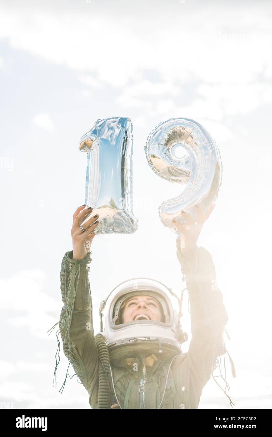 Beautiful Woman poses with number 19 dressed as an astronaut Stock ...