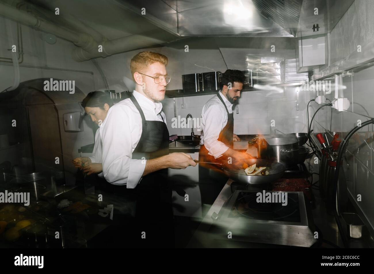 The cook making a flambe Stock Photo - Alamy