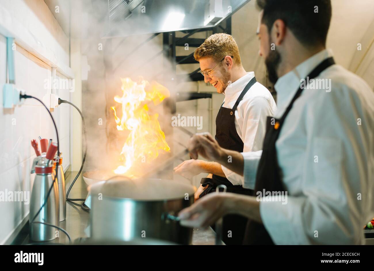 The cook making a flambe Stock Photo - Alamy