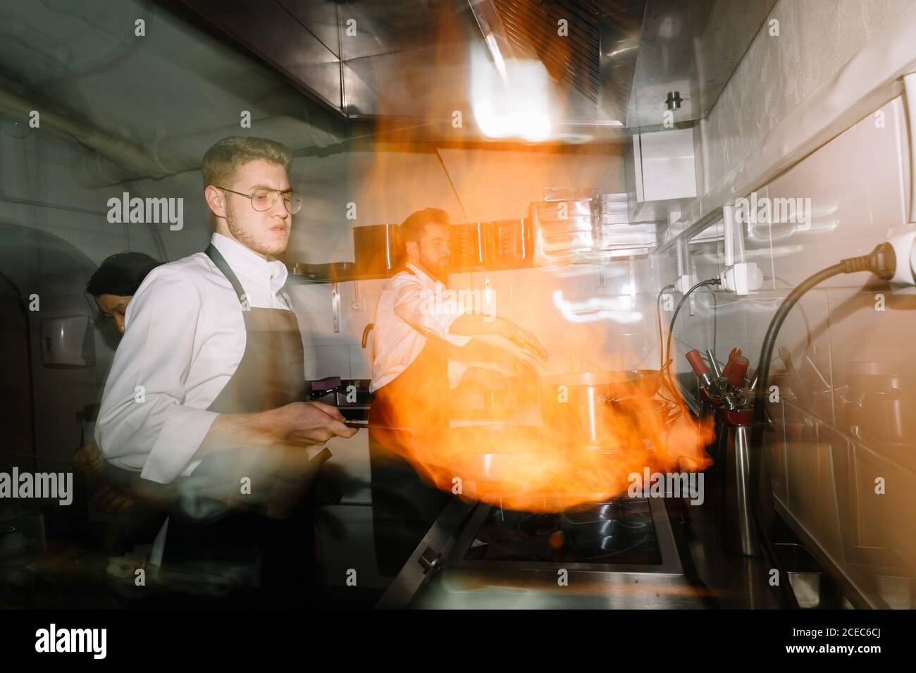 The cook making a flambe Stock Photo - Alamy