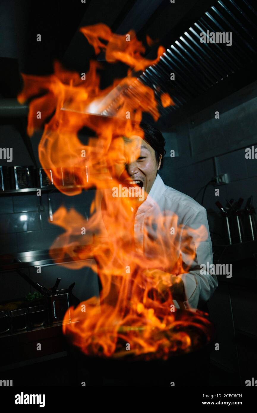 The cook making a flambe Stock Photo - Alamy