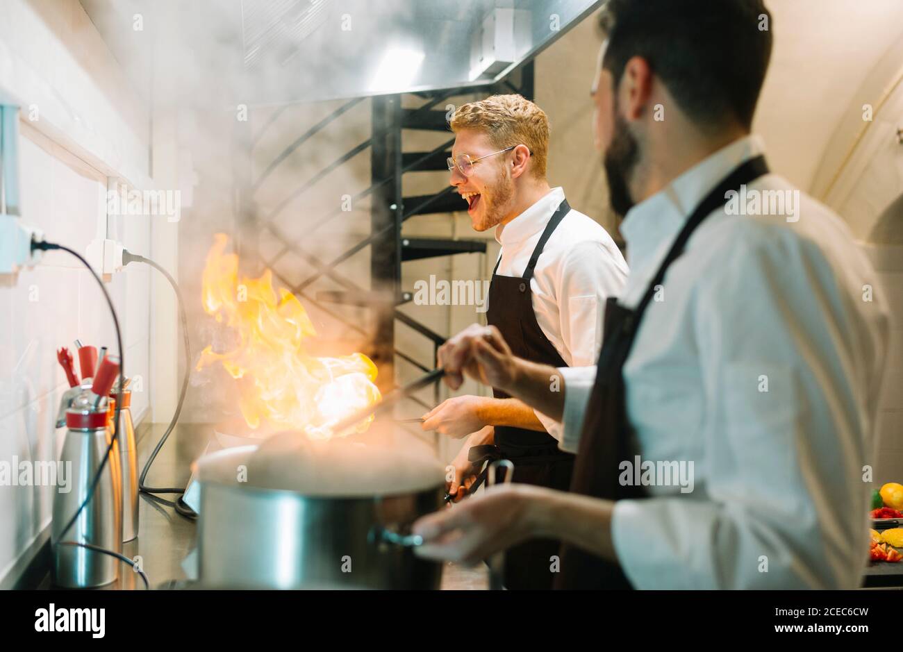 The cook making a flambe Stock Photo - Alamy