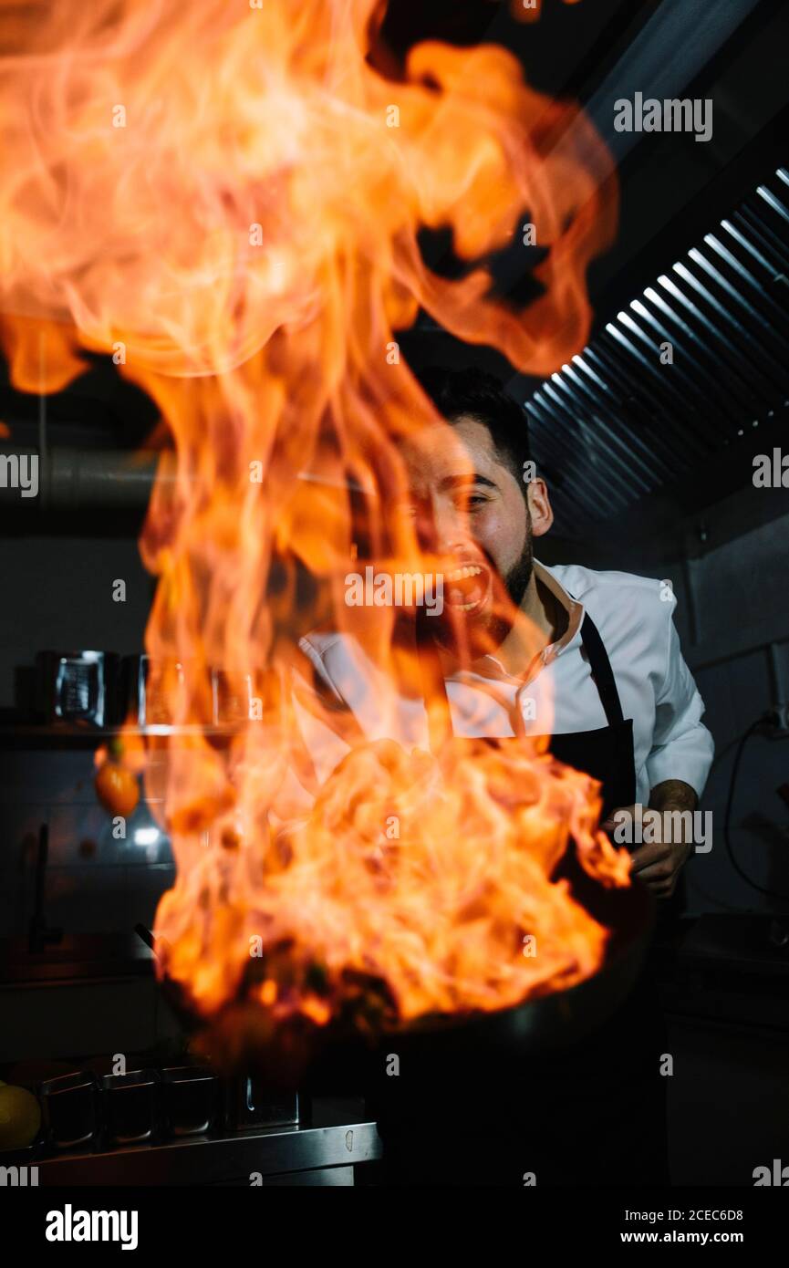 The cook making a flambe Stock Photo - Alamy
