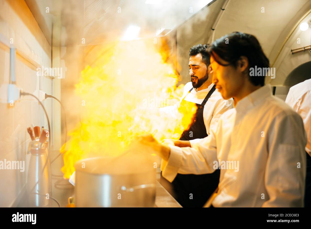The cook making a flambe Stock Photo - Alamy