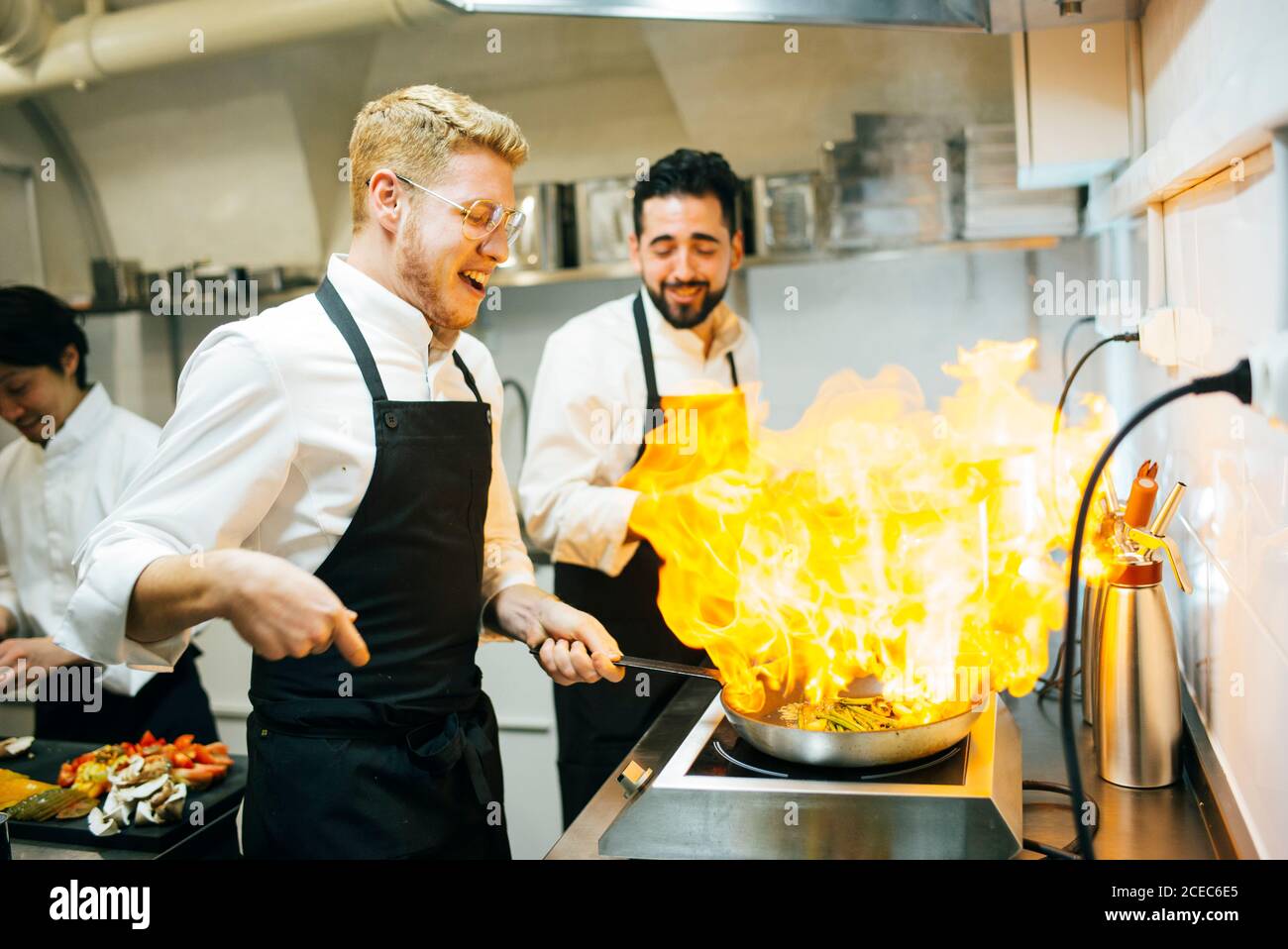 The cook making a flambe Stock Photo - Alamy