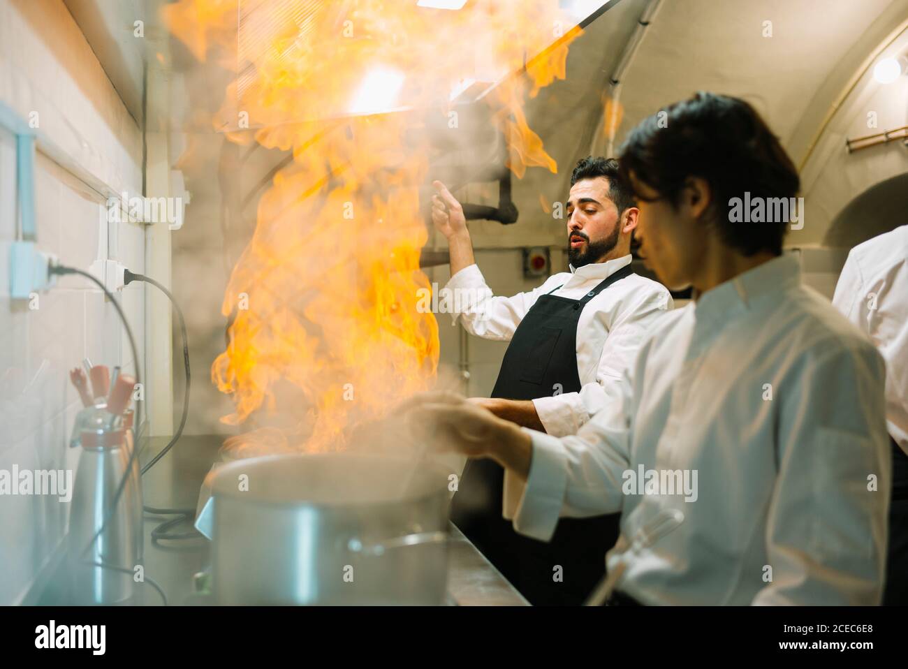 The cook making a flambe Stock Photo - Alamy