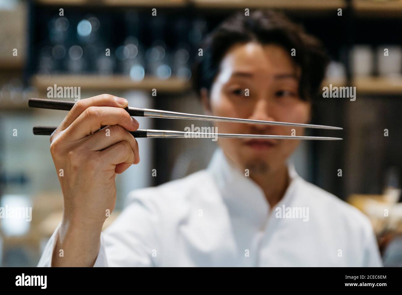 Japanese chef with chopsticks Stock Photo - Alamy