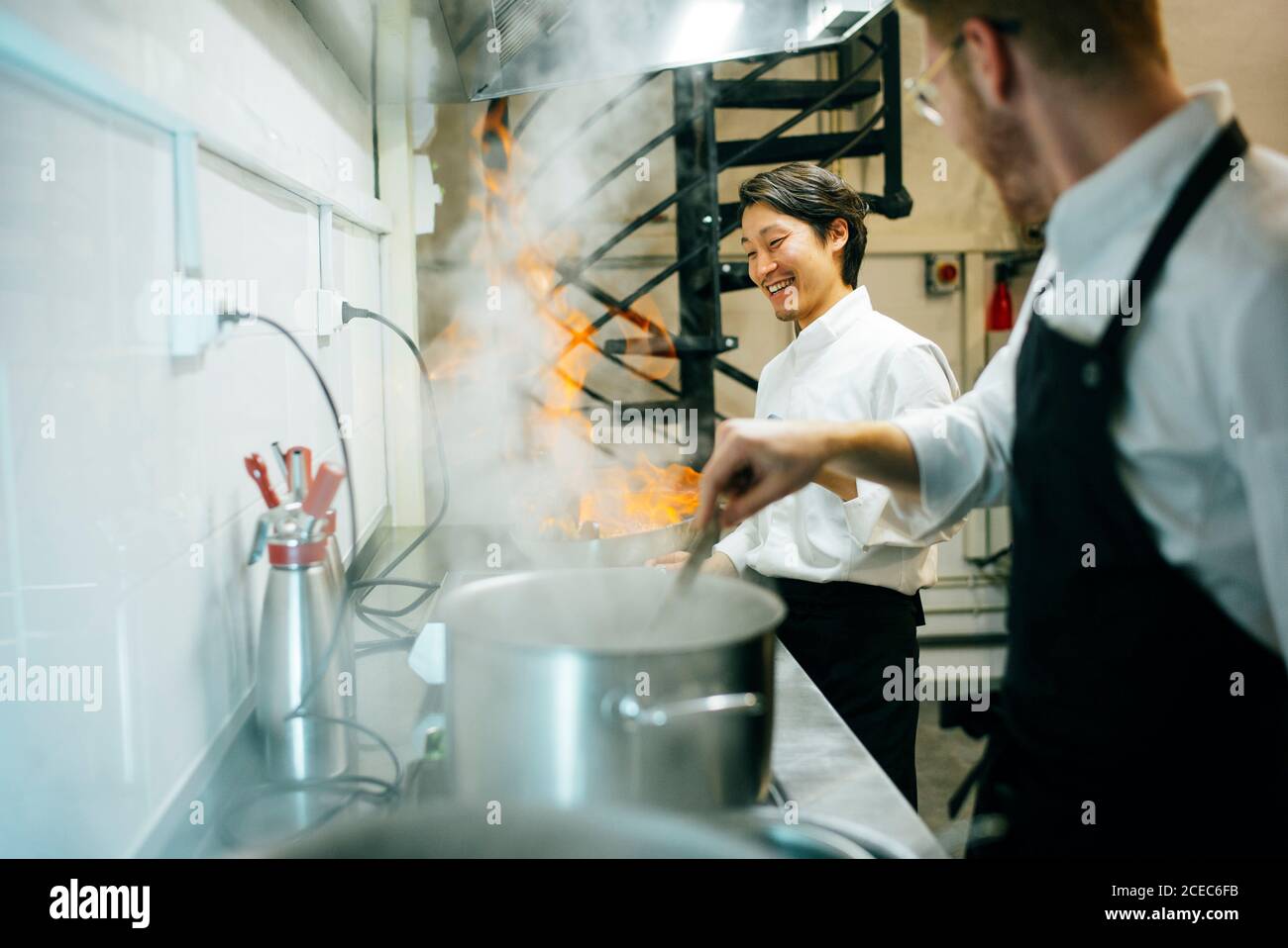 The cook making a flambe Stock Photo - Alamy