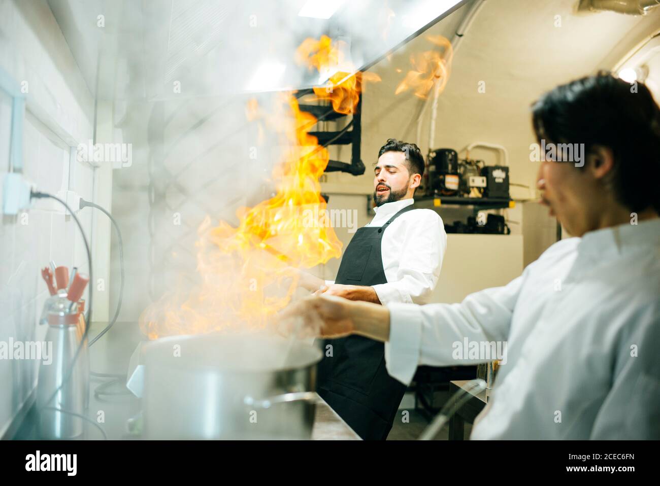 The cook making a flambe Stock Photo - Alamy