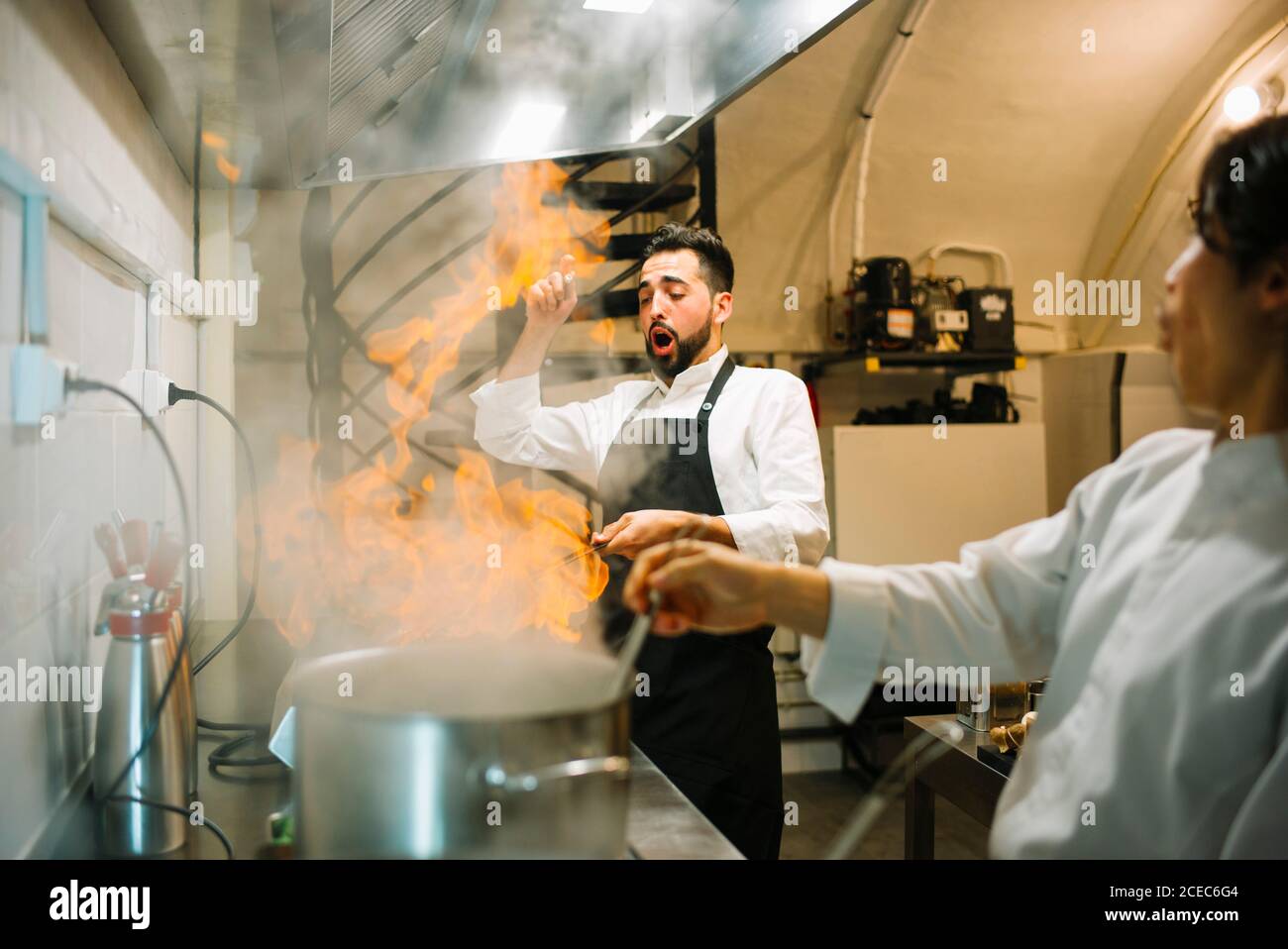 The cook making a flambe Stock Photo - Alamy