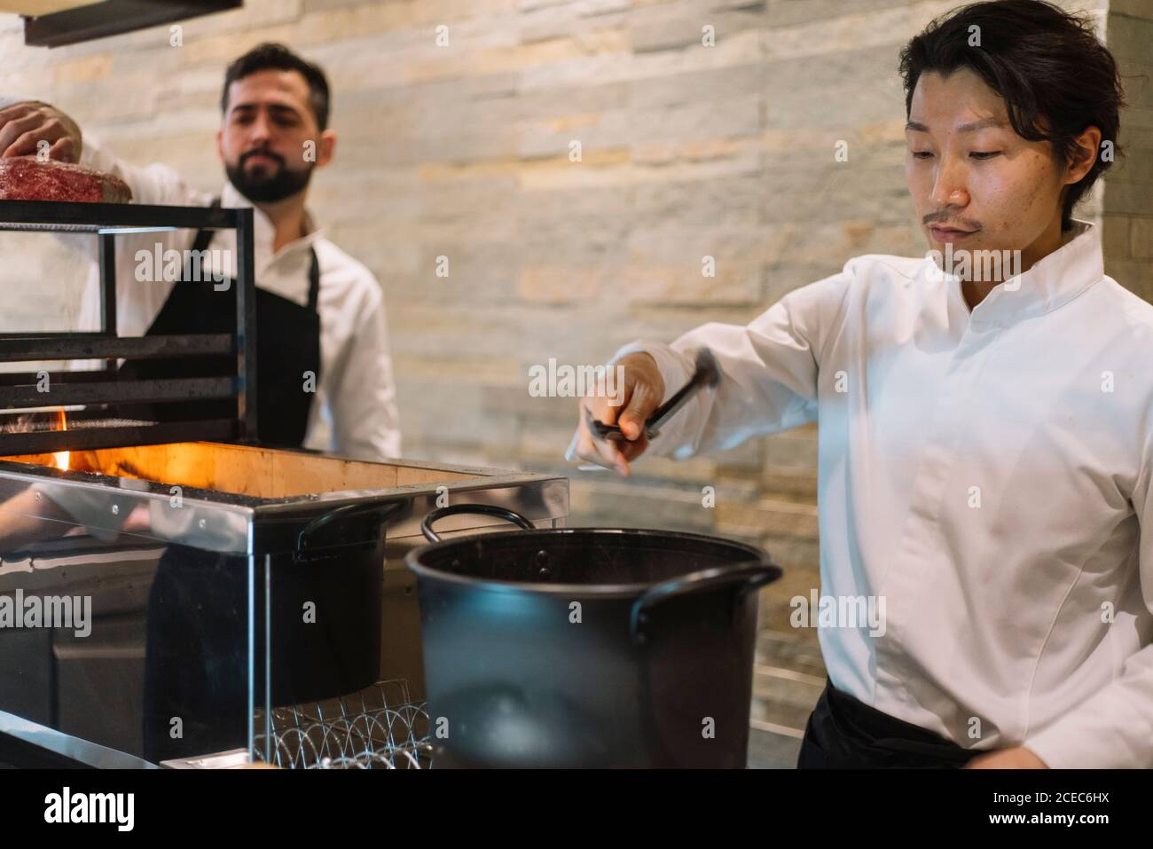 Chef cooking in restaurant Stock Photo - Alamy