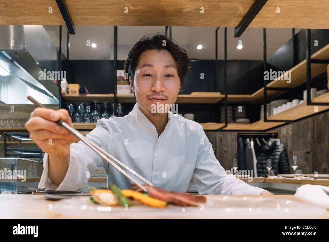 Chef cooking in restaurant Stock Photo - Alamy