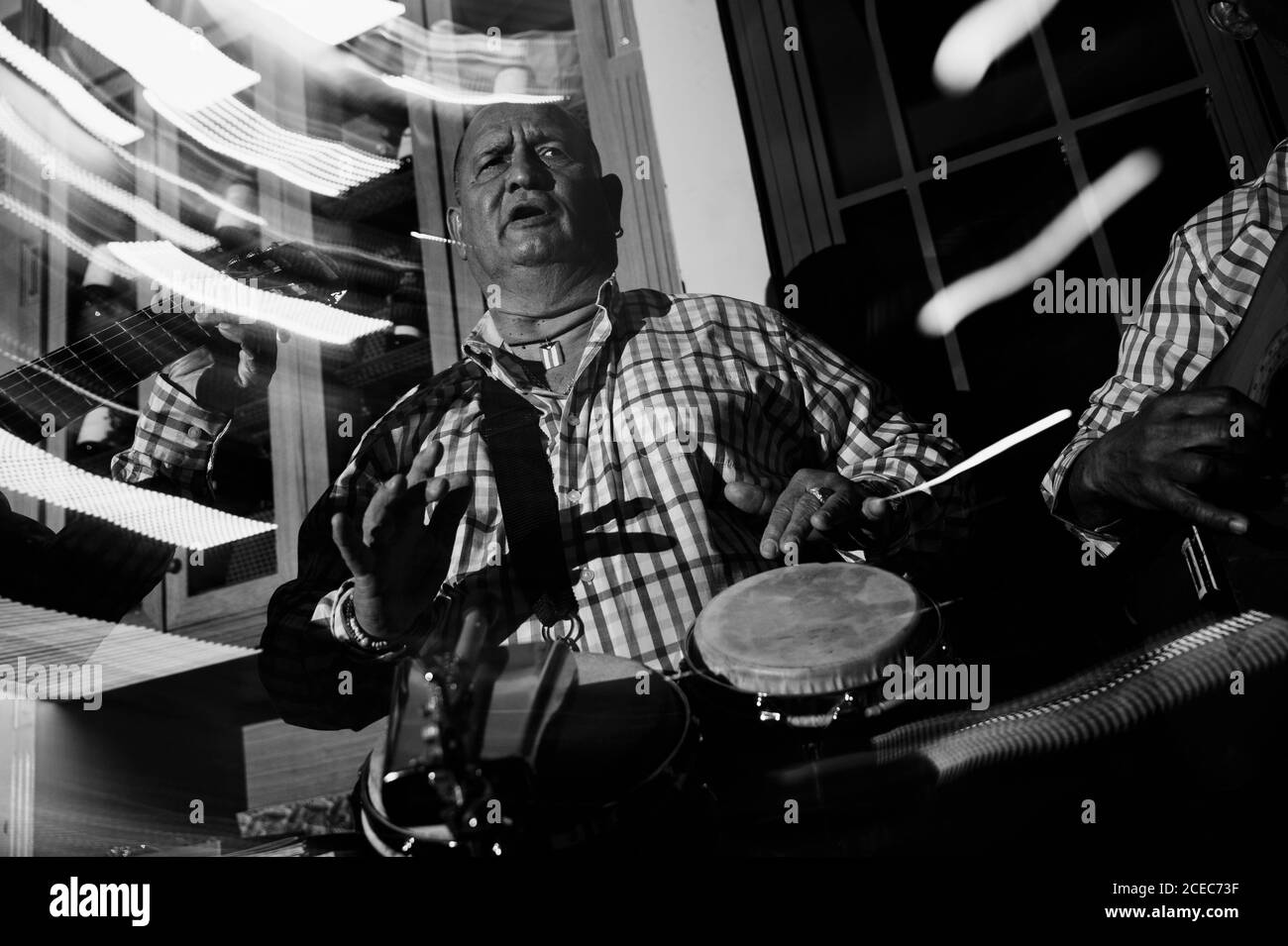 Cuban musical trio acting in the night club Stock Photo - Alamy