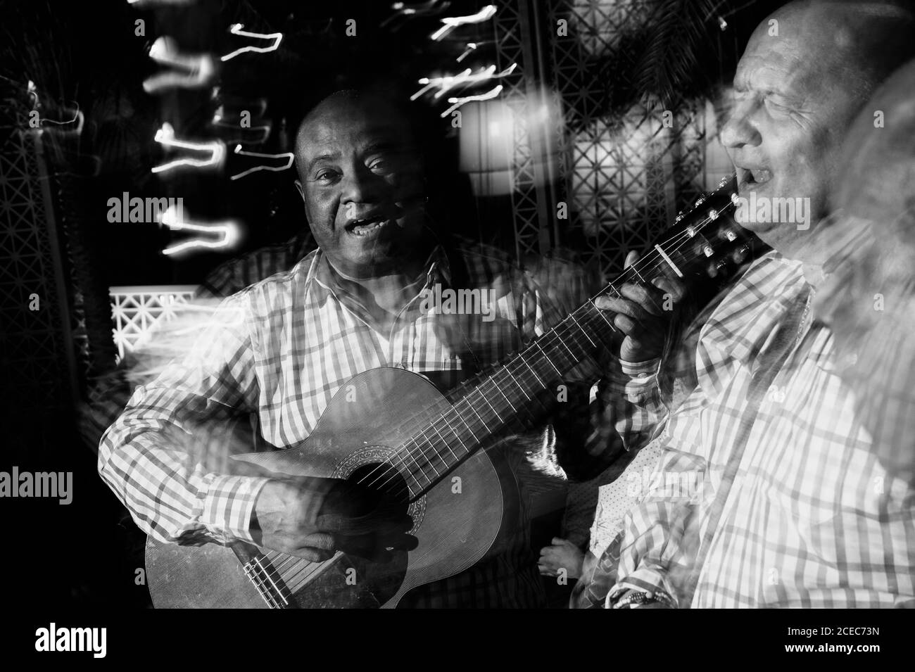 Cuban musical trio acting in the night club Stock Photo - Alamy