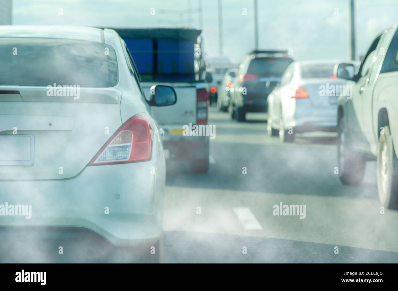 Pollution from vehicle exhaust in the city. Traffic jam on the road ...