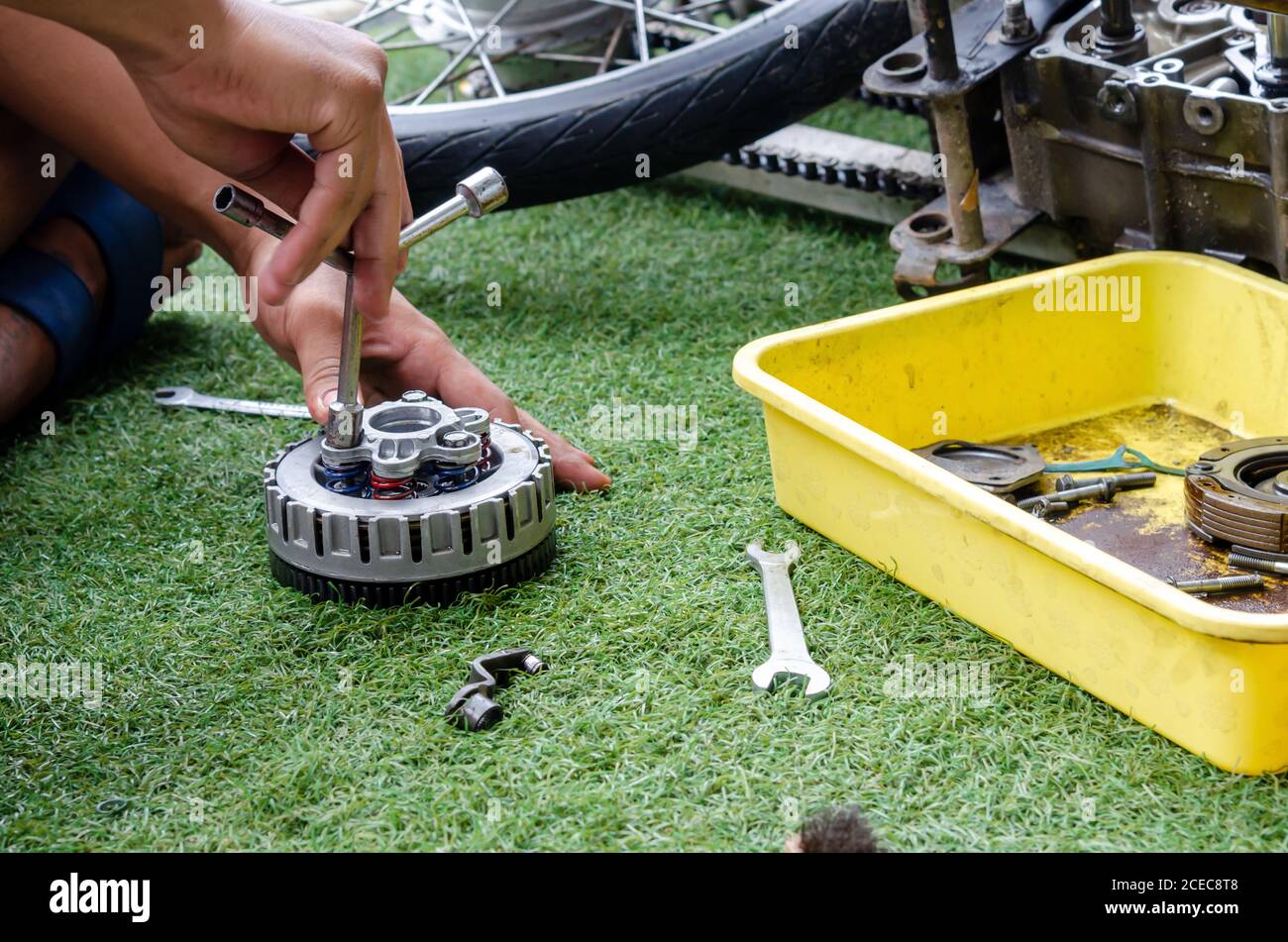 Mechanic repairing a motorcycle engine Stock Photo - Alamy