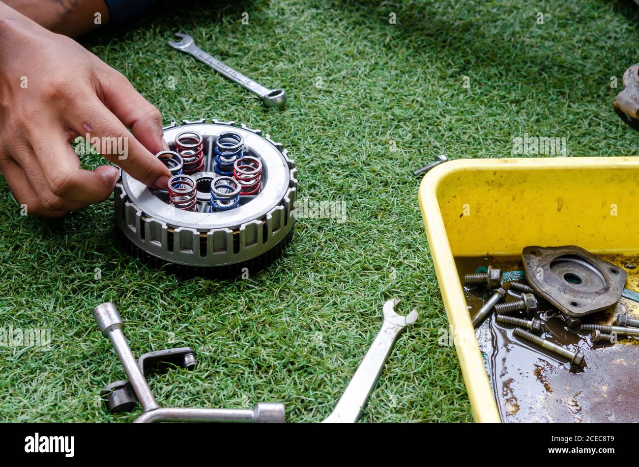 Mechanic repairing a motorcycle engine Stock Photo - Alamy