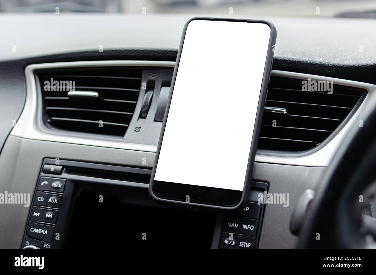 Mobile phone on the car air vent.Blank with white screen Stock Photo ...