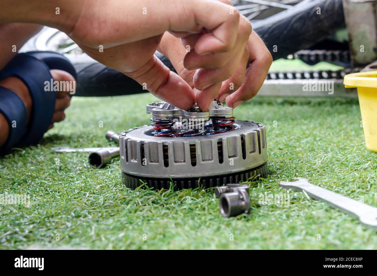 Mechanic repairing a motorcycle engine Stock Photo - Alamy