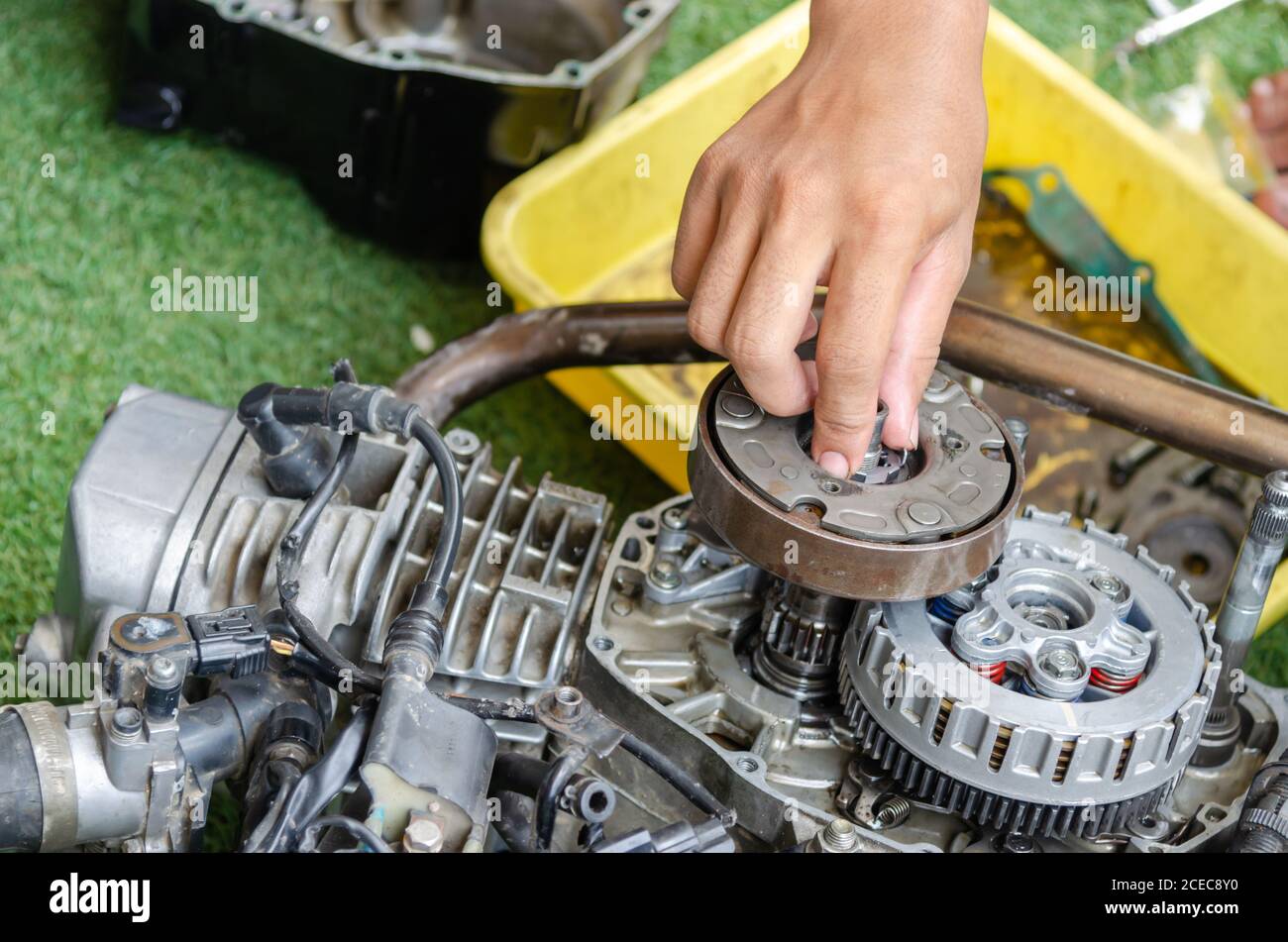 Mechanic repairing a motorcycle engine Stock Photo - Alamy