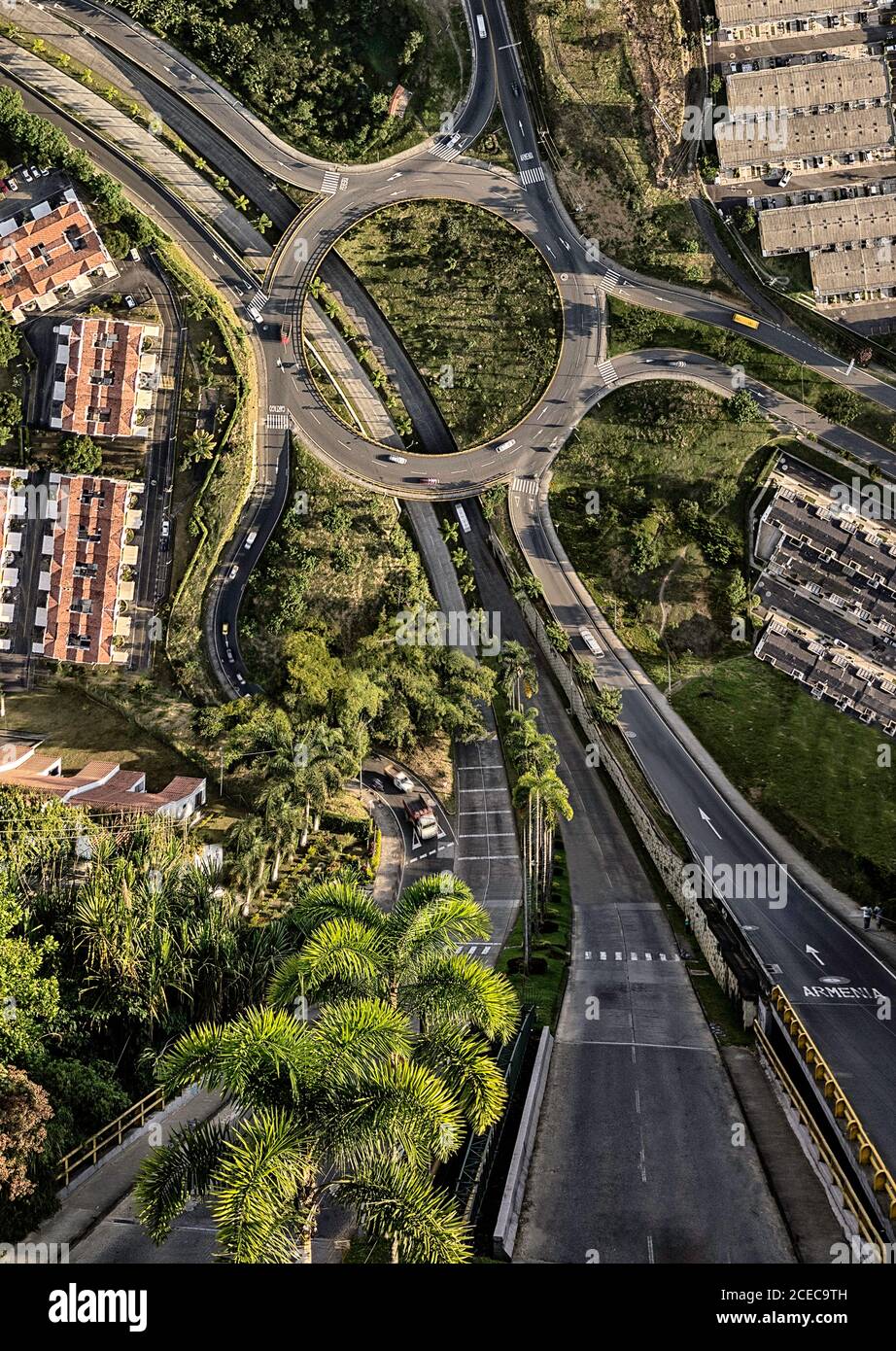 Perspective view of cars driving on road in the city driving upwards ...