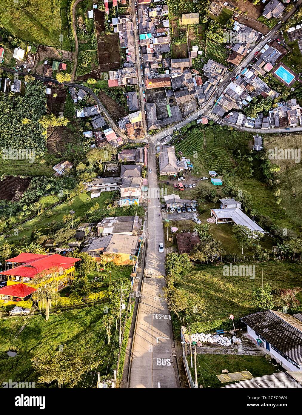 Perspective view of cars driving on road in the city driving upwards ...