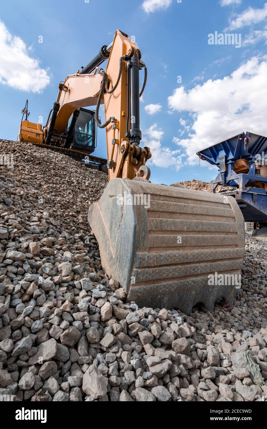 Quarry land with heavy industrial machinery Stock Photo - Alamy