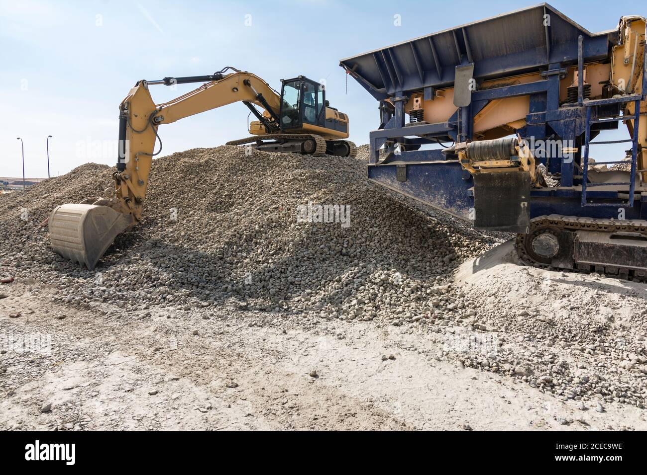 Quarry land with heavy industrial machinery Stock Photo - Alamy