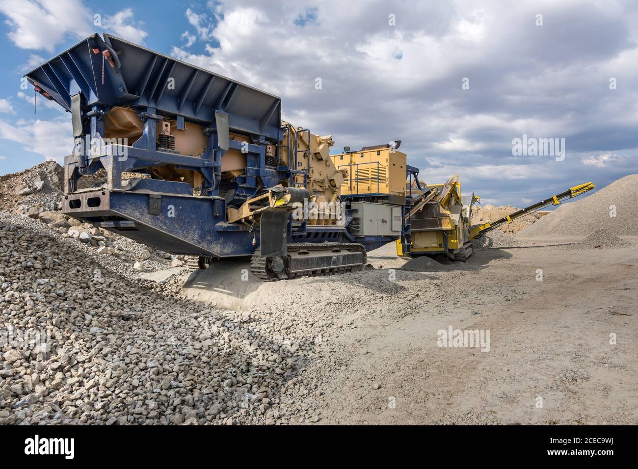 Quarry land with heavy industrial machinery Stock Photo - Alamy