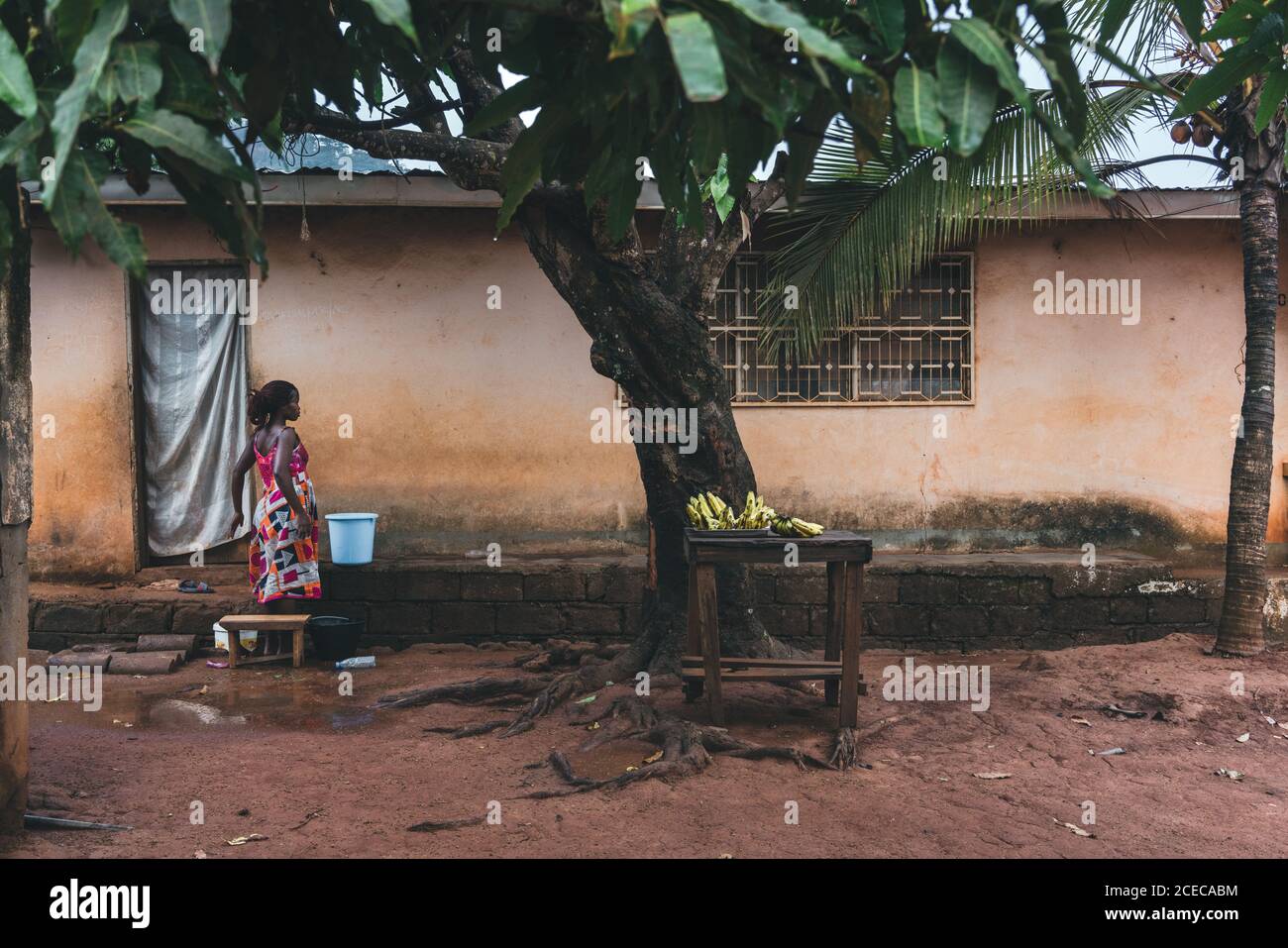 CAMEROON - AFRICA - APRIL 5, 2018: Side view of ethnic Woman standing ...