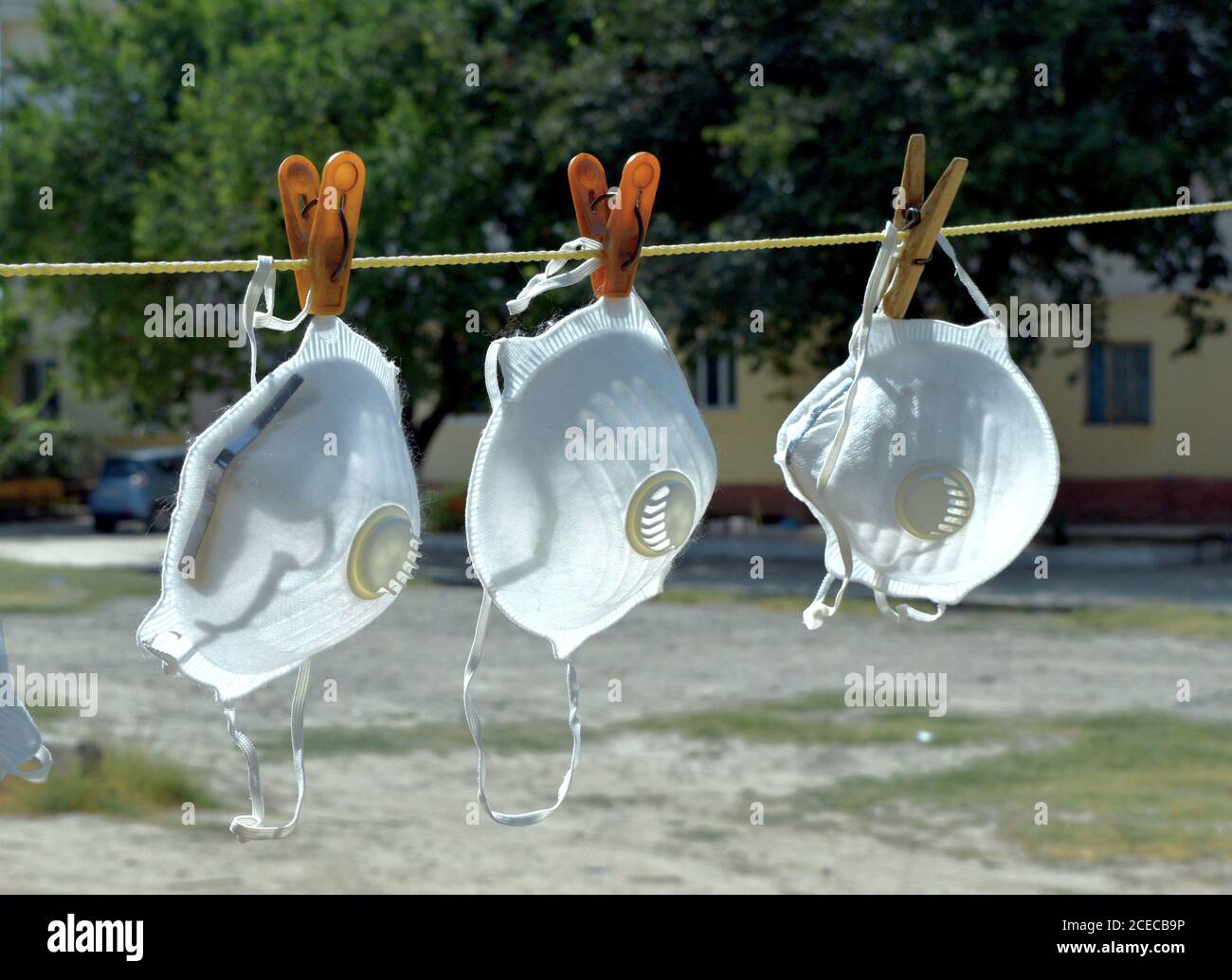 Medical masks hanging on a clothesline Stock Photo - Alamy