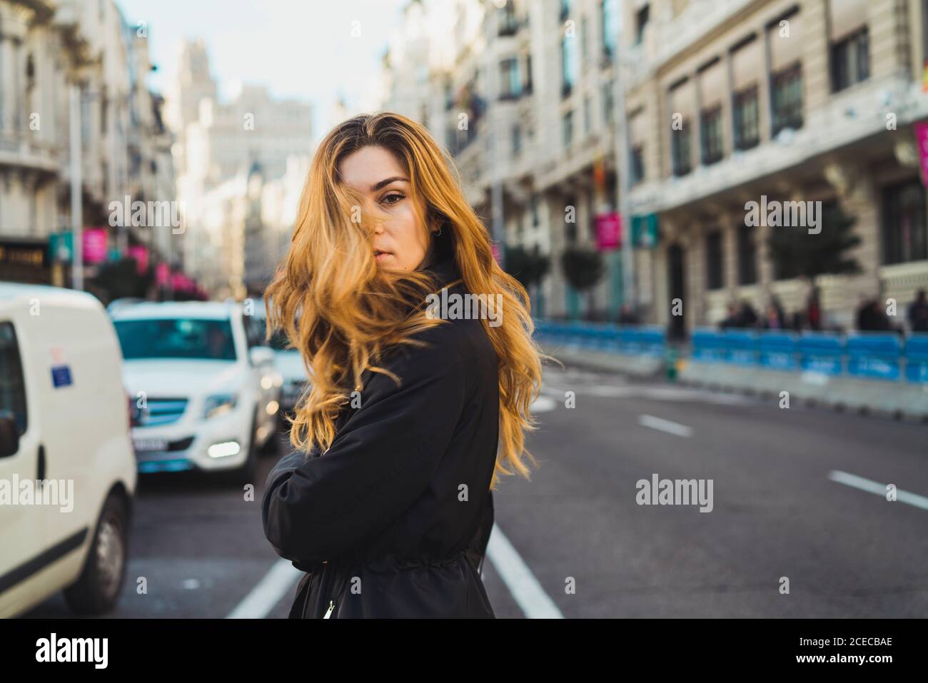 Woman posing on road Stock Photo - Alamy