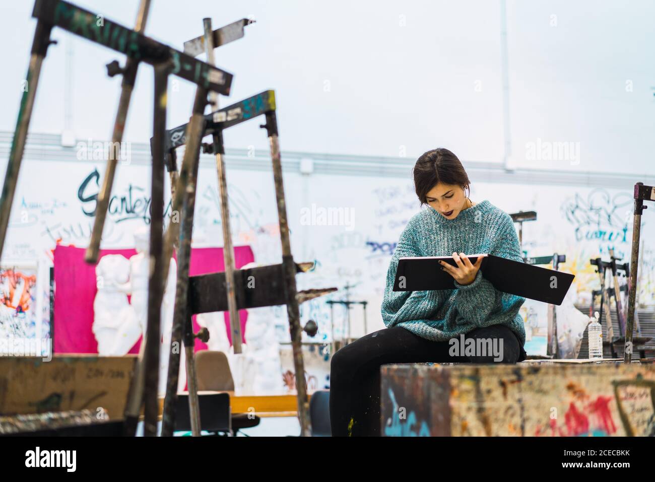 Woman creating drawing in studio Stock Photo - Alamy