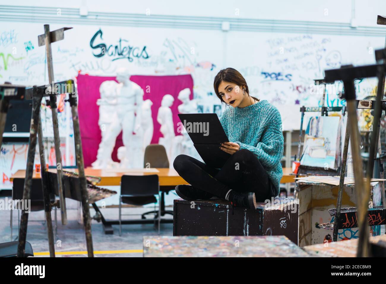 Woman creating drawing in studio Stock Photo - Alamy