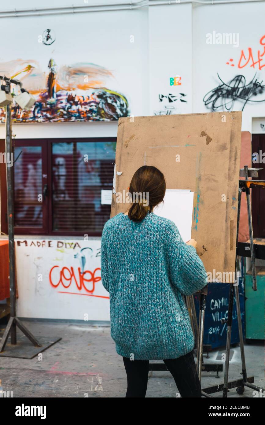 Woman creating drawing in studio Stock Photo - Alamy