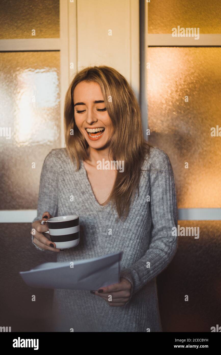 Shocked Woman with papers Stock Photo - Alamy