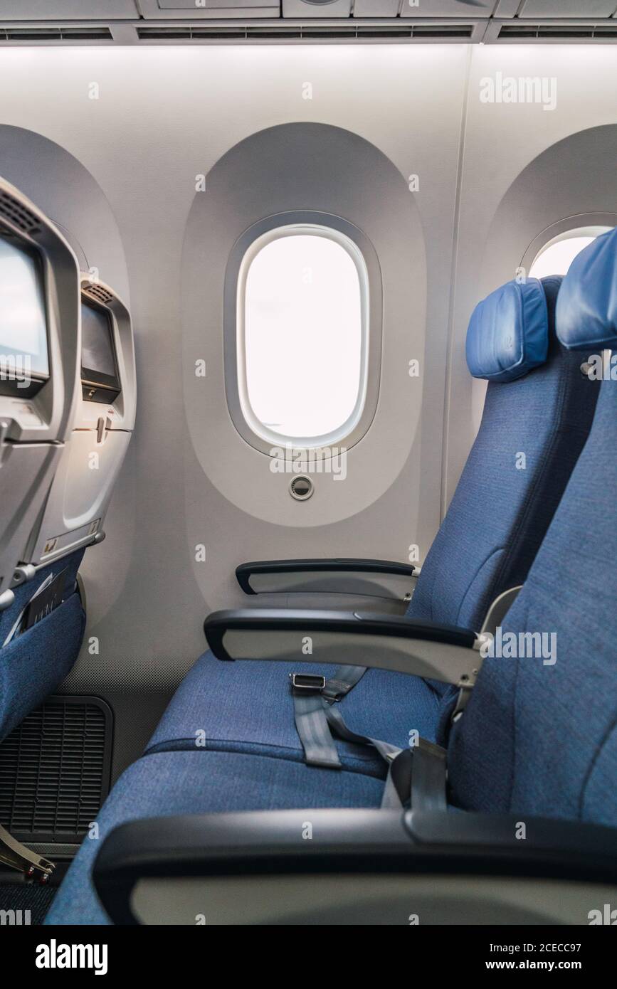 Aisle in modern plane cabin Stock Photo - Alamy