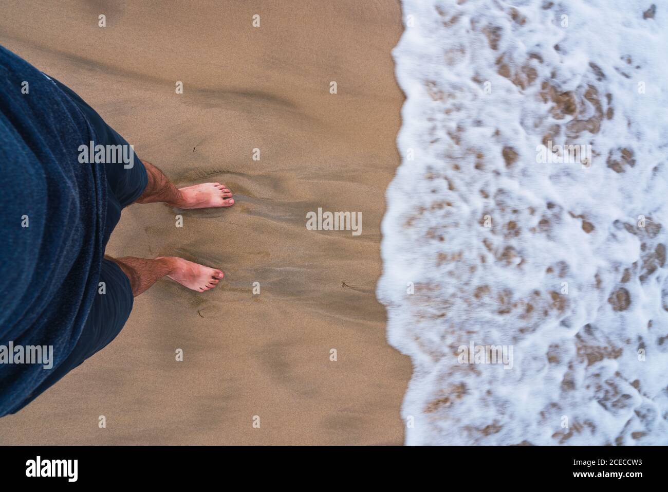 Man running from wave hi-res stock photography and images - Alamy