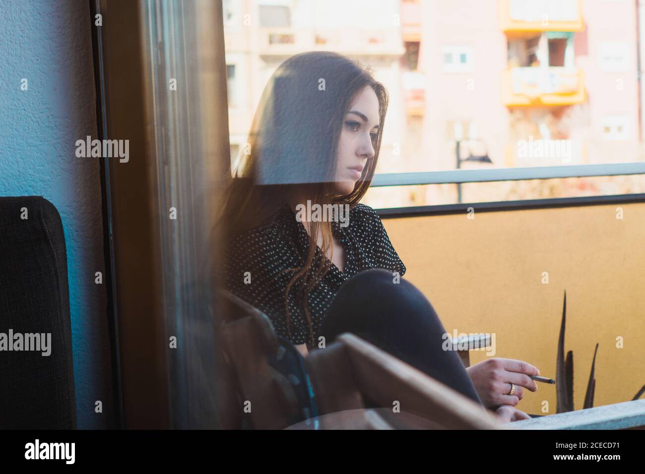 Smoking on a balcony hi-res stock photography and images - Alamy