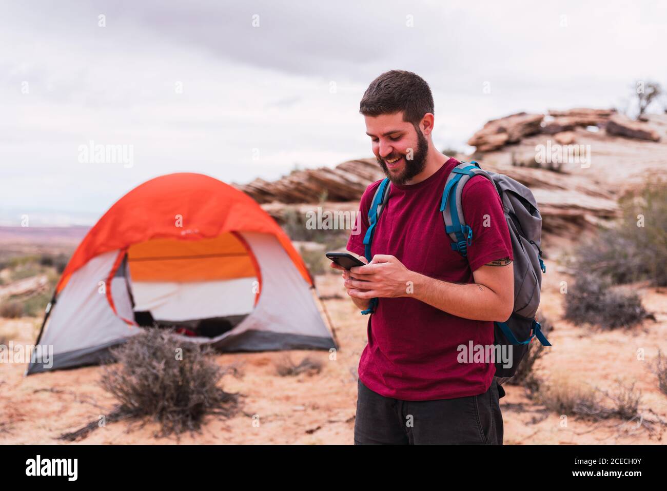 Traveler using smartphone Stock Photo - Alamy