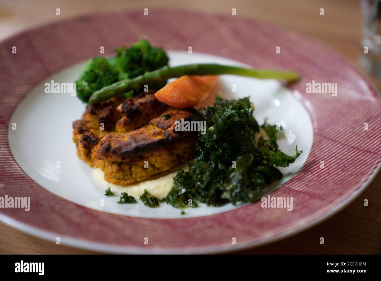 From above view of delicacy consisting of fried meat and green ...