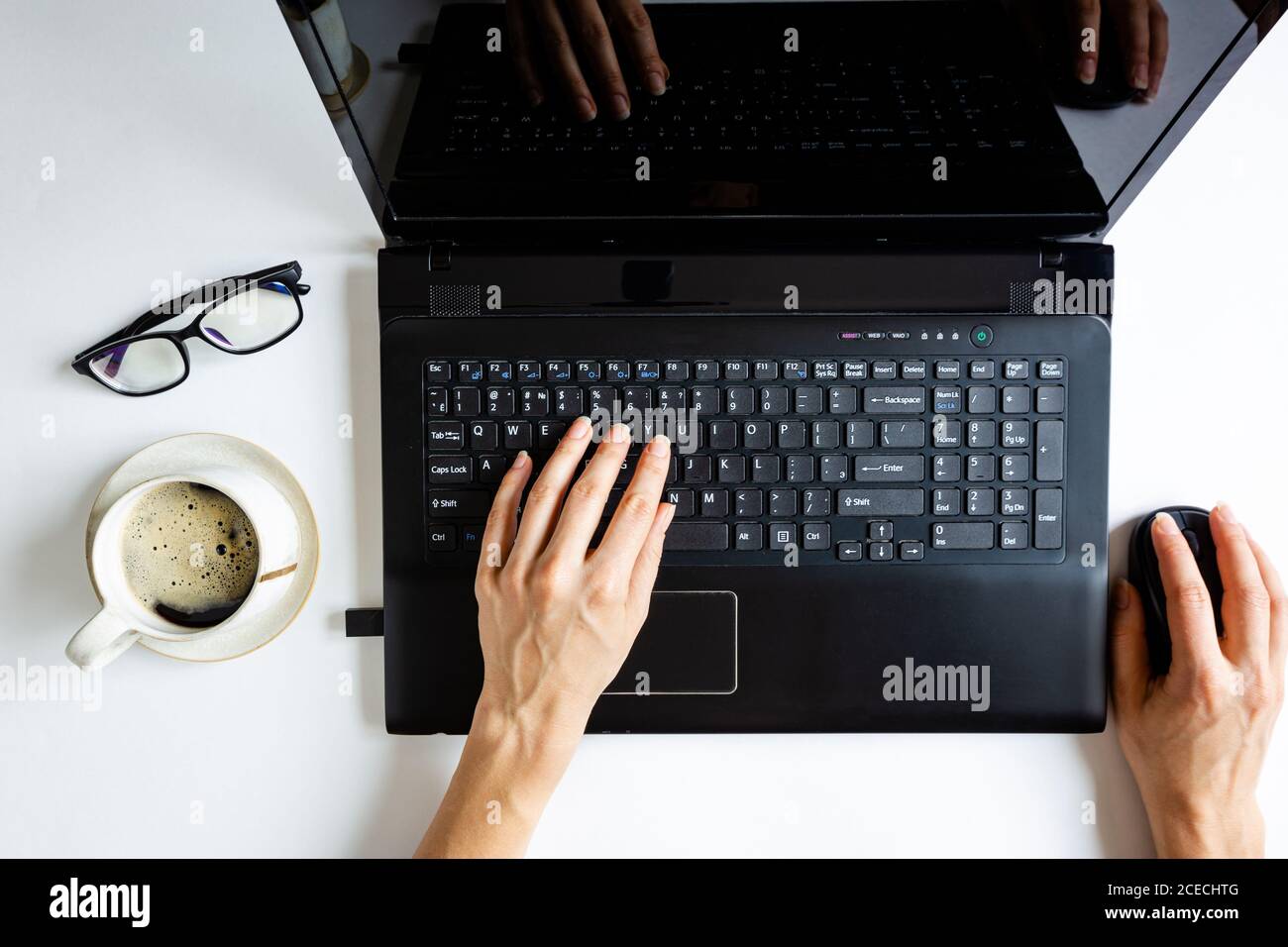 black laptop and girls hands Stock Photo - Alamy