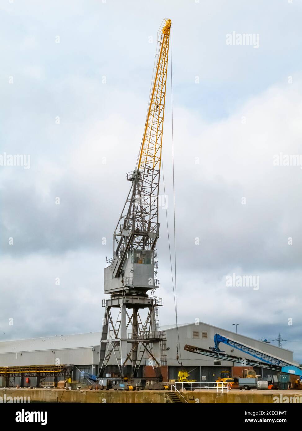 A moveable gantry crane on the waterside of the docks at the Port of ...