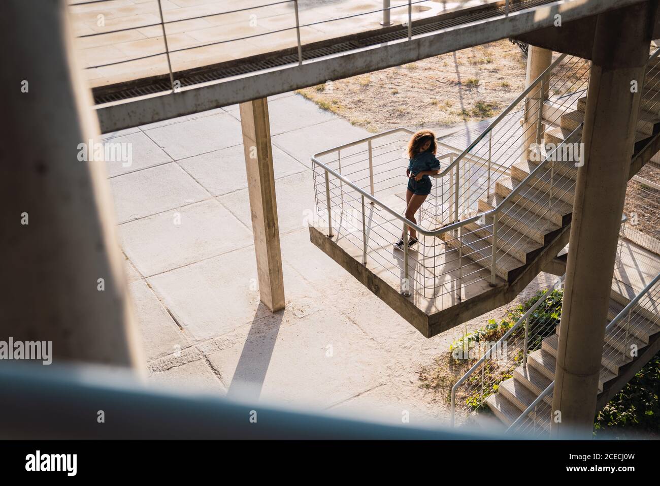 Woman go downstairs hi-res stock photography and images - Alamy