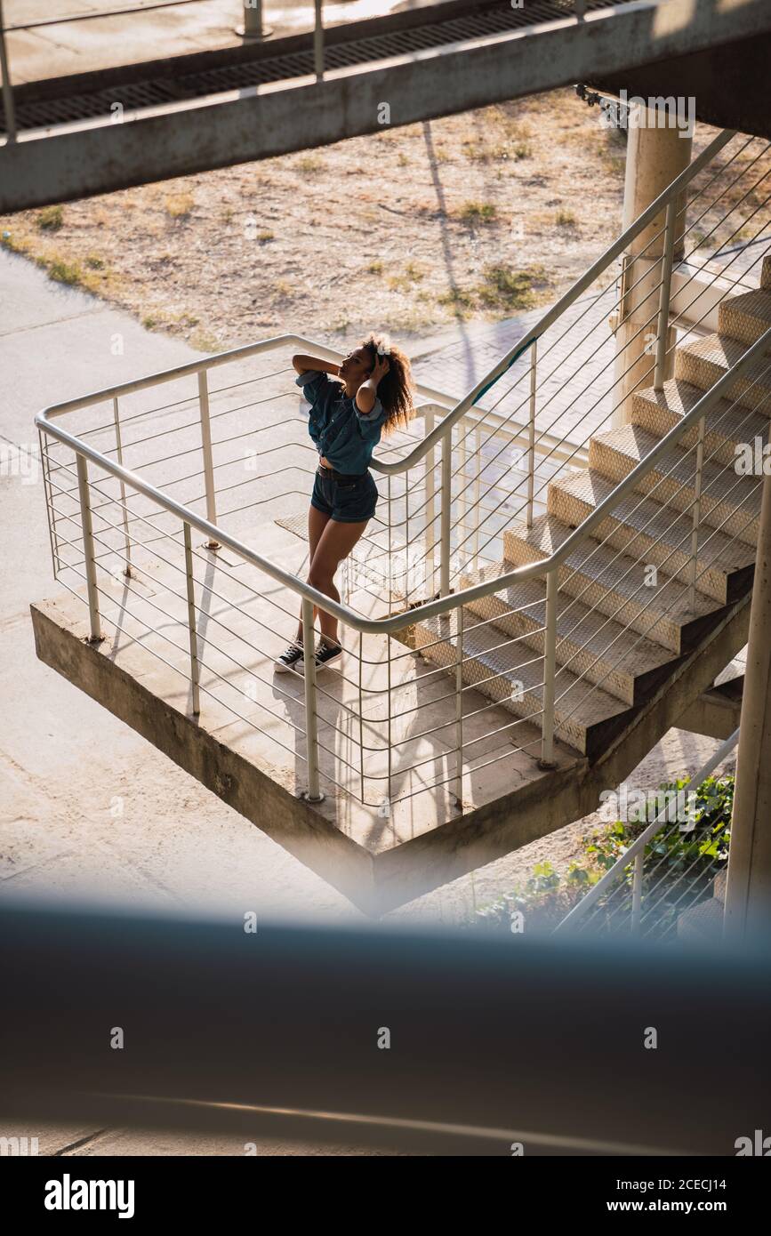 Woman go downstairs hi-res stock photography and images - Alamy